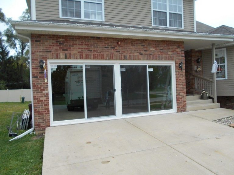 Garage Doors With Wrought Iron Windows — Randolph Indoor and Outdoor Design